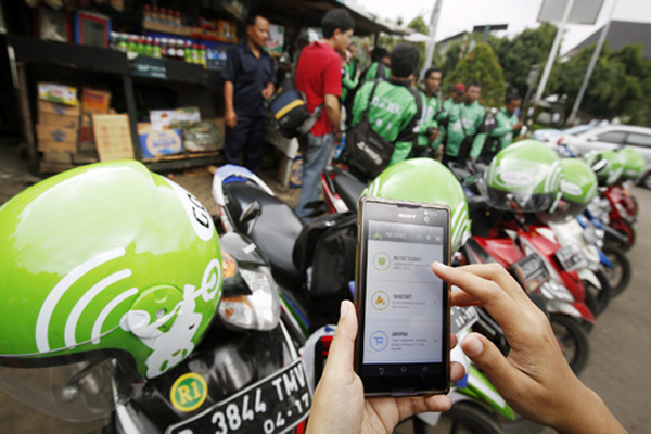 Go-Jek drivers’, partners’ earnings total Rp 10 trillion, UI survey ...
