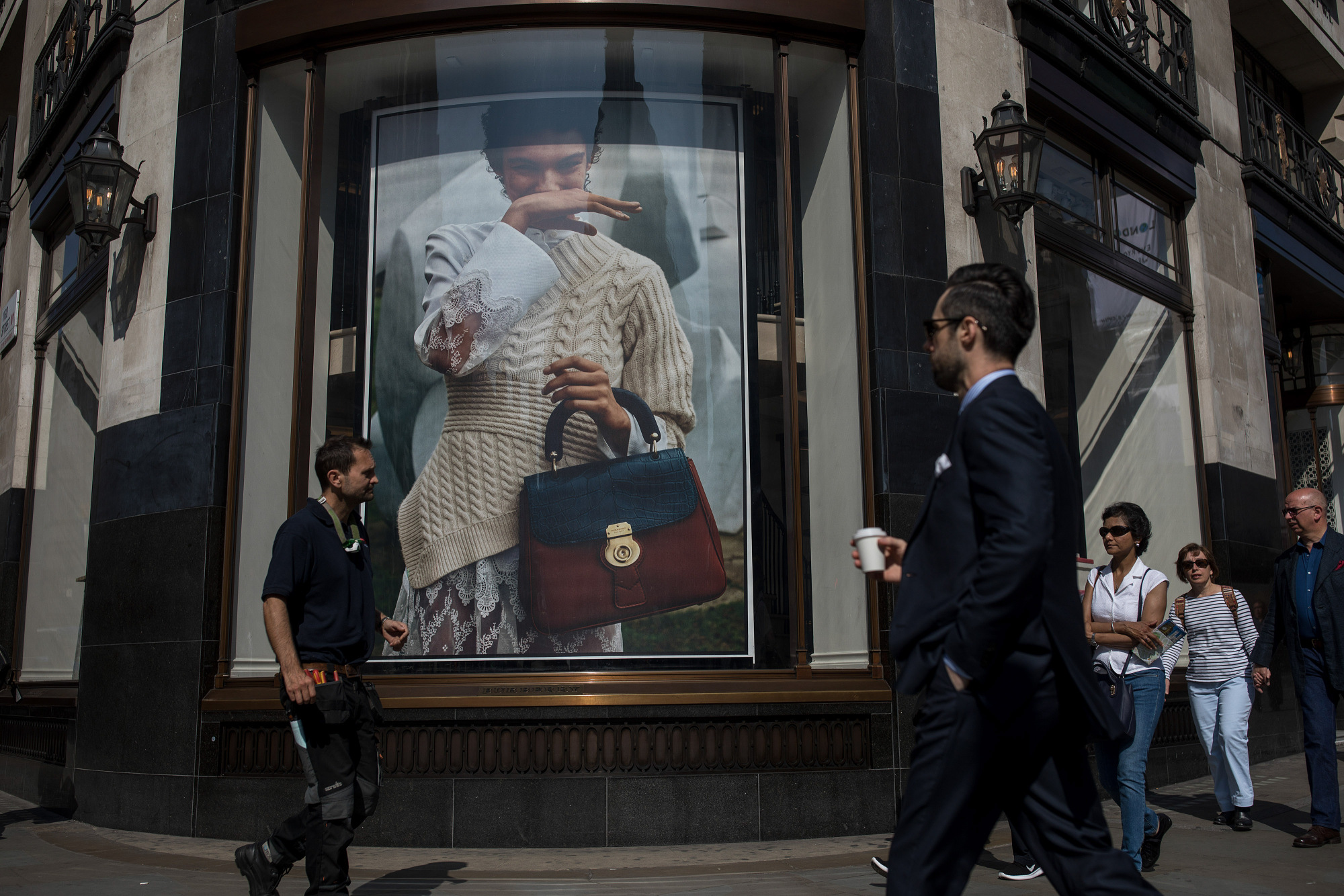 Burberry says new designer creating buzz to drive turnaround ...
