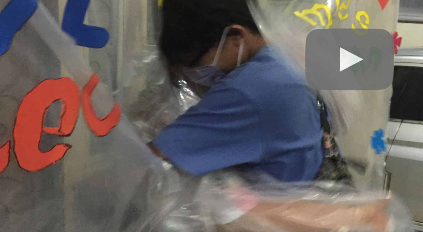 Video: Grandmother makes ‘hug curtain’ to embrace family - The Jakarta Post