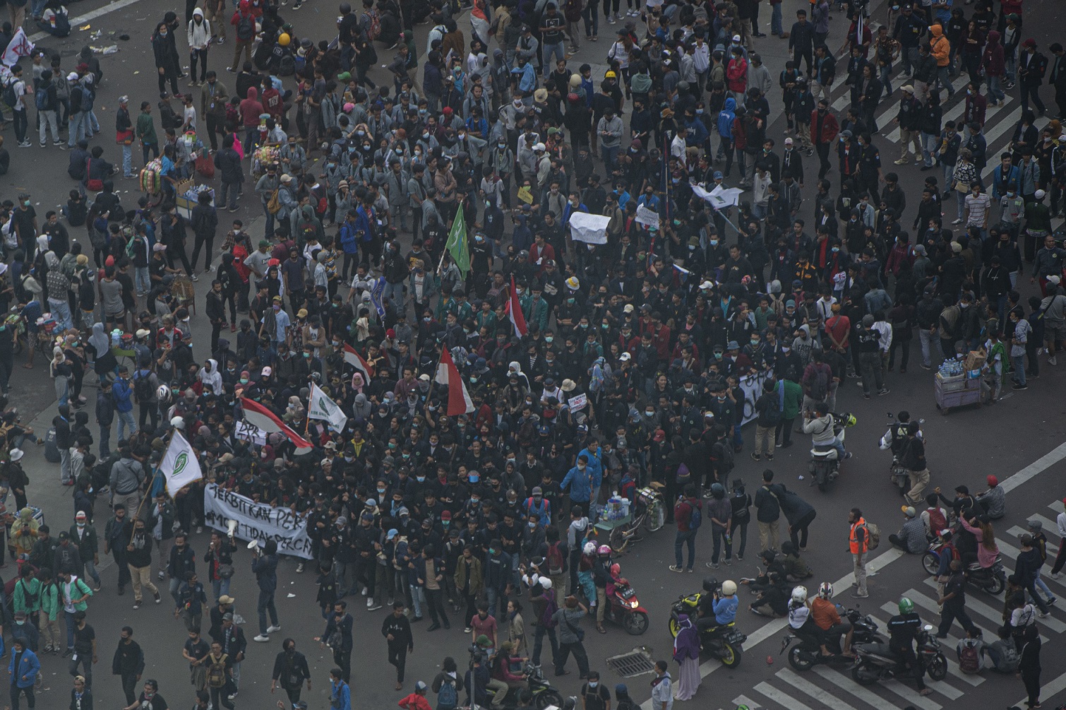 Workers return to street to protest against jobs law, demand wage hike ...