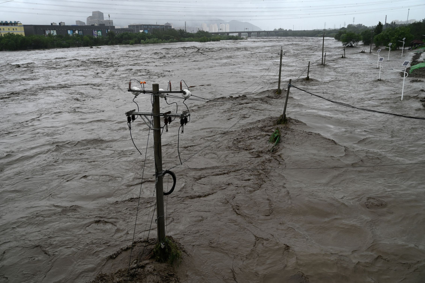 Beijing on alert with two killed as heavy rain batters north China ...