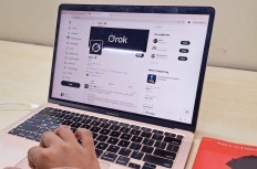 A person opens the home page of Grok on the social media platform X on April 16 on a computer in Jakarta. 